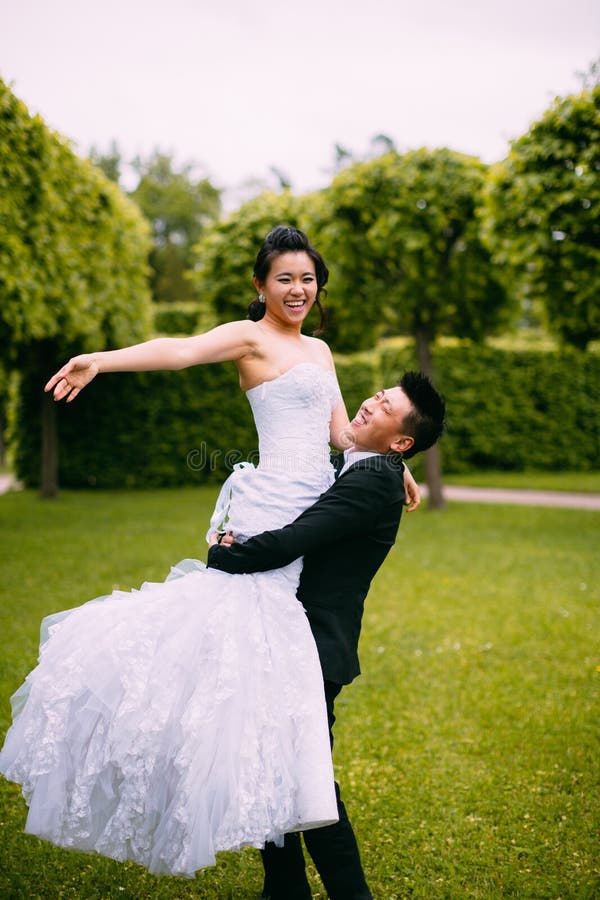 Groom holding bride stock photo. Image of feelings, direction - 82910638