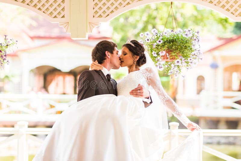 Groom Holding Bride in His Arms Stock Photo - Image of lovers ...