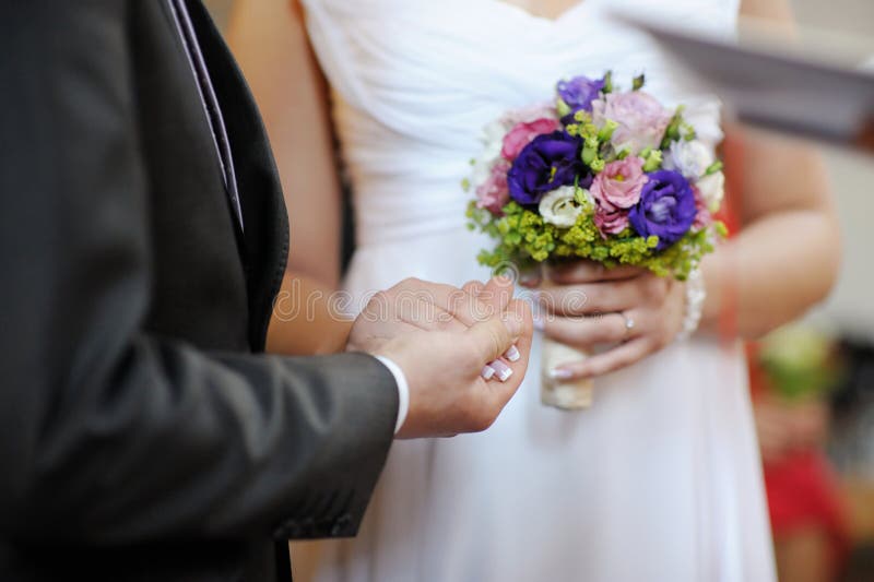 Groom holding bride s hand stock photo. Image of hand - 17125374