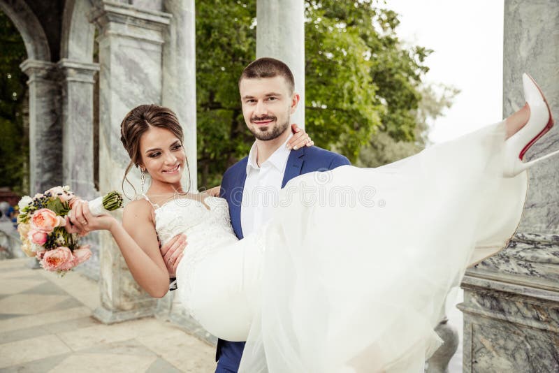 Groom holding a bride stock photo. Image of husband, fashion - 83533096