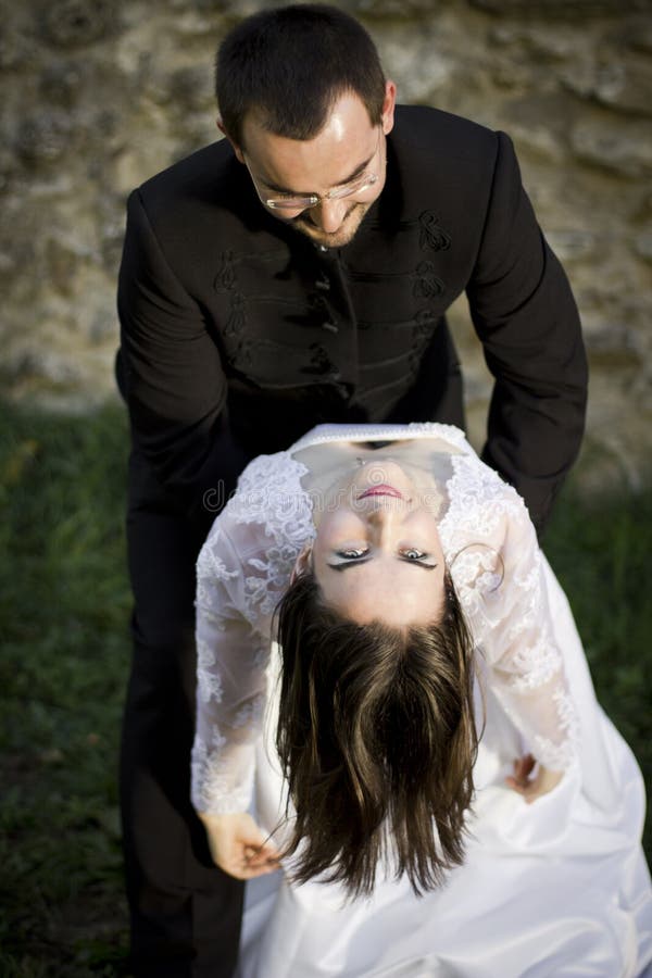 Groom holding his bride stock image. Image of female - 28213553