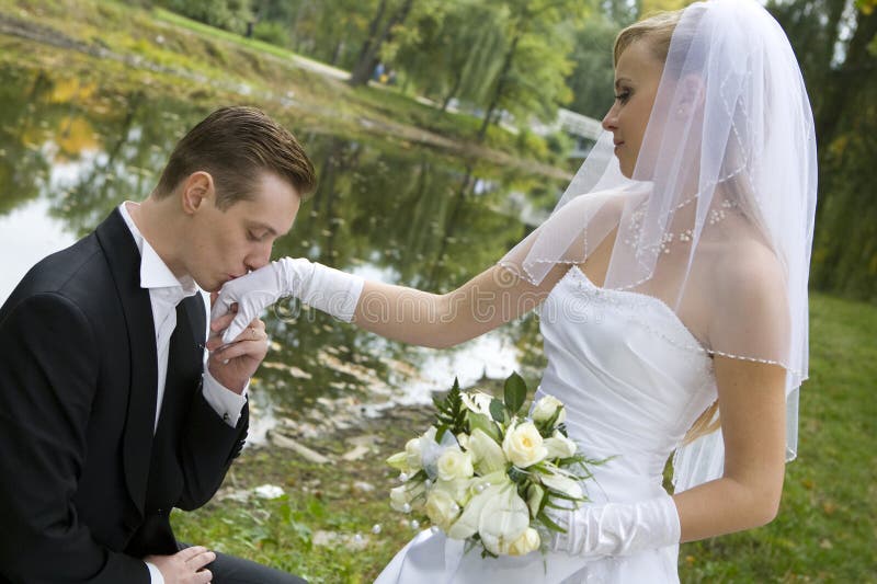 Groom kissing bride s hand stock image. Image of lady - 16967627