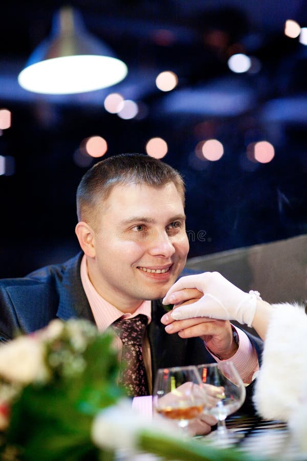 Groom Kissing Hand of the Bride Stock Photo - Image of lady, lights ...
