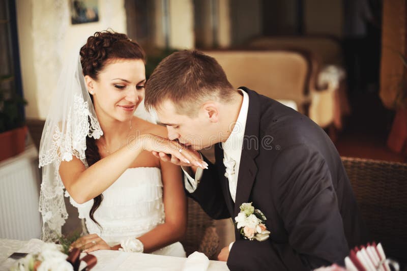 Groom Kissing Hand of His Lovely Bride Stock Image - Image of romance ...