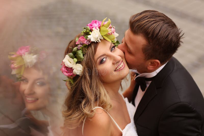 Groom kissing his bride stock image. Image of feeling - 87426969