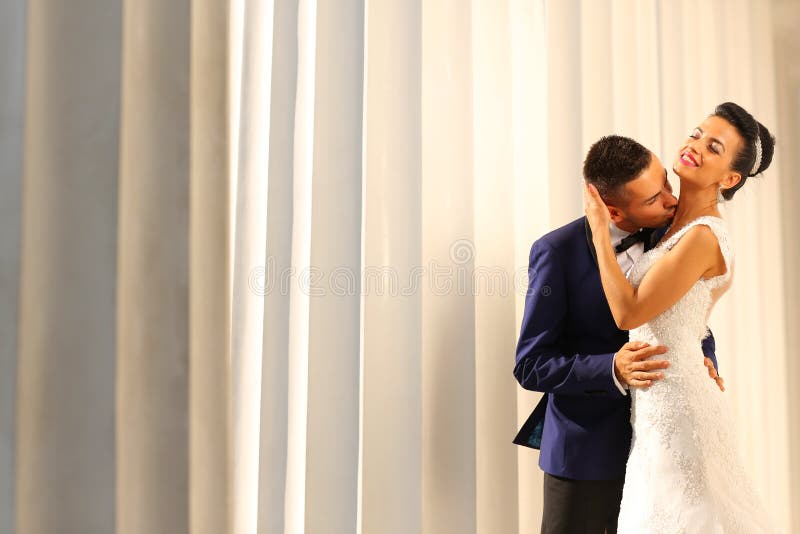Groom kissing his bride stock image. Image of couple - 88503353