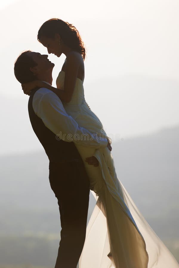 Groom Lift Bride Wedding Outdoor And Hug With Love For Commitment In