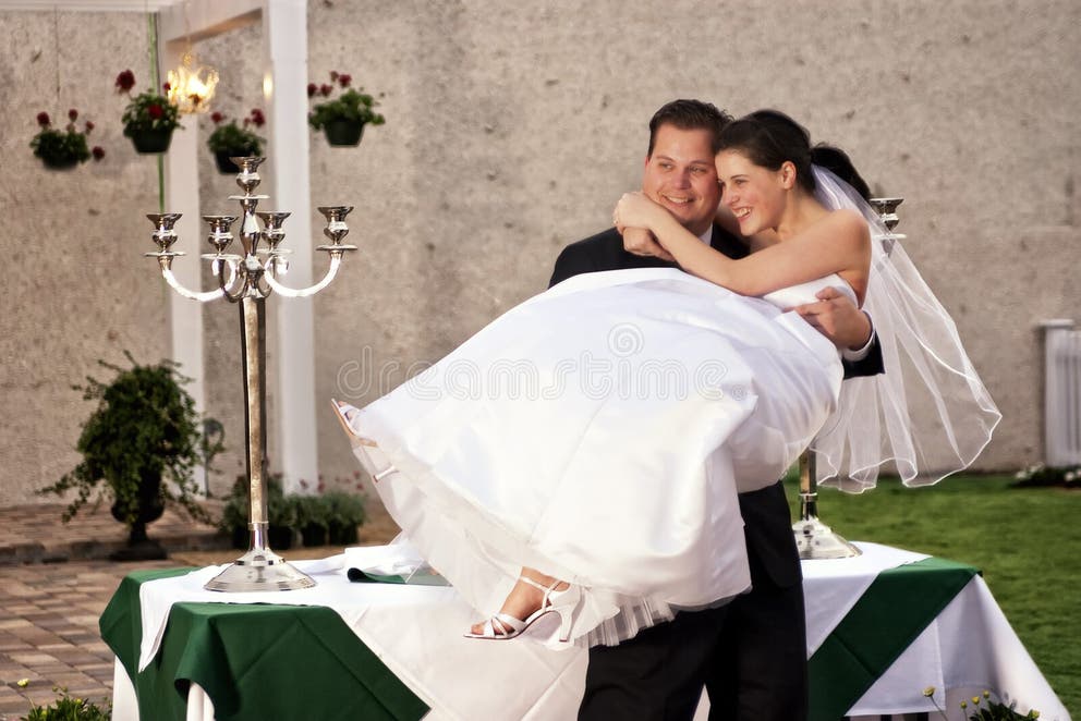 Groom Lifting Bride Laughing Stock Image - Image of brunette, love: 8508201