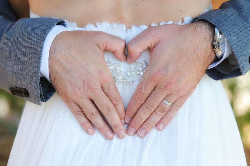 Groom Making a Heart with Hands Bride Back Stock Image - Image of ring ...