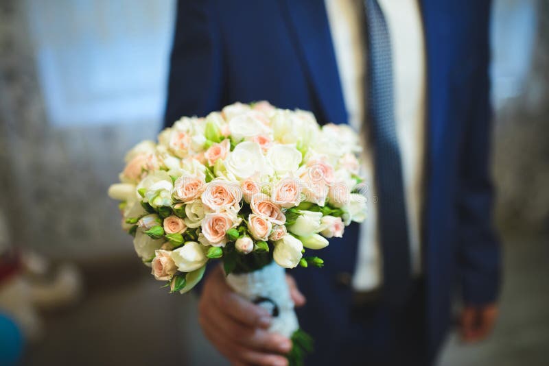 Groom with Rose Bouquet stock photo. Image of suit, adult - 81028556