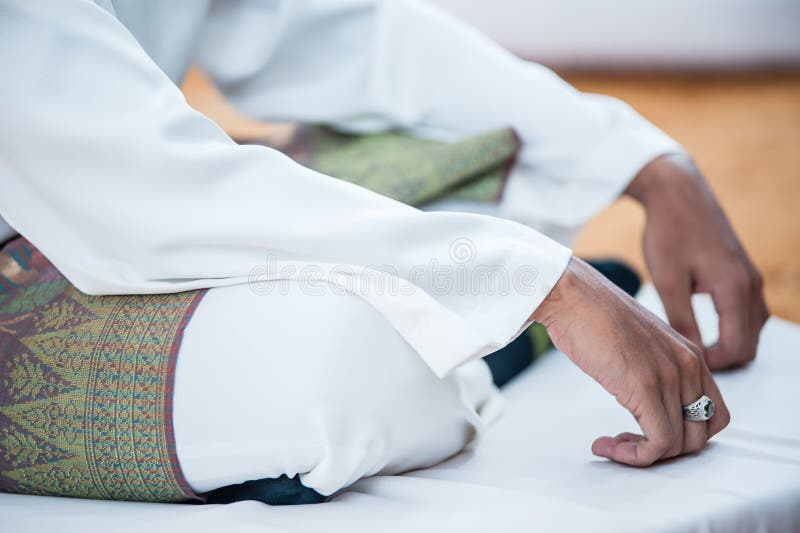 Groom s hands on lap stock image. Image of jewelleries - 33414493