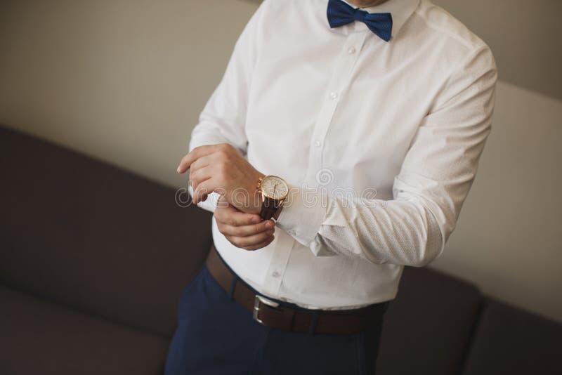 The Groom& X27;s Pack, Who Puts a Watch on His Hand Stock Photo - Image ...