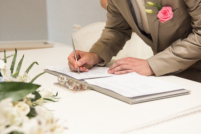 Groom Signing Marriage License or Wedding Contract Stock Image - Image ...