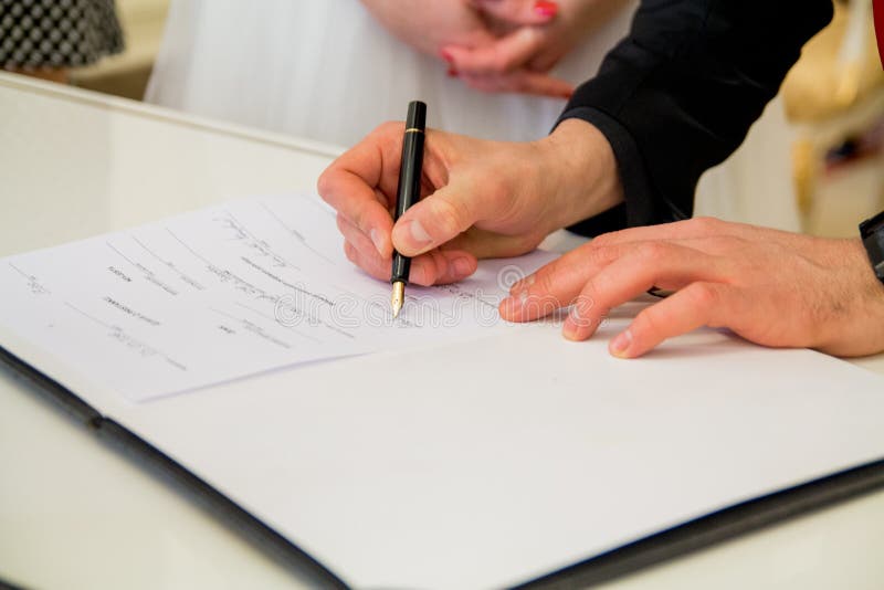Groom Signing Wedding Documents Stock Photo - Image of writing, brand ...