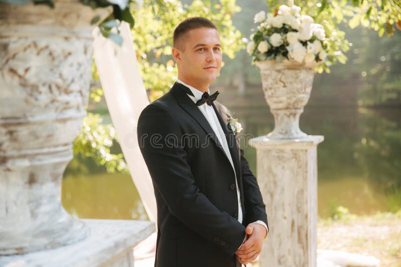 Groom Standing by the Decorated Tree and Waiting for Bride Stock Image ...