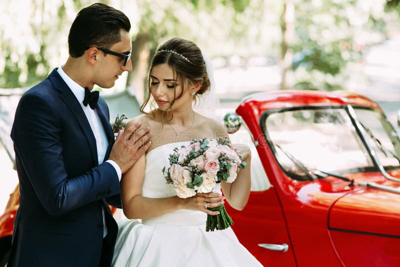 Groom is Standing Next To His Cute Bride Stock Photo - Image of bouquet ...
