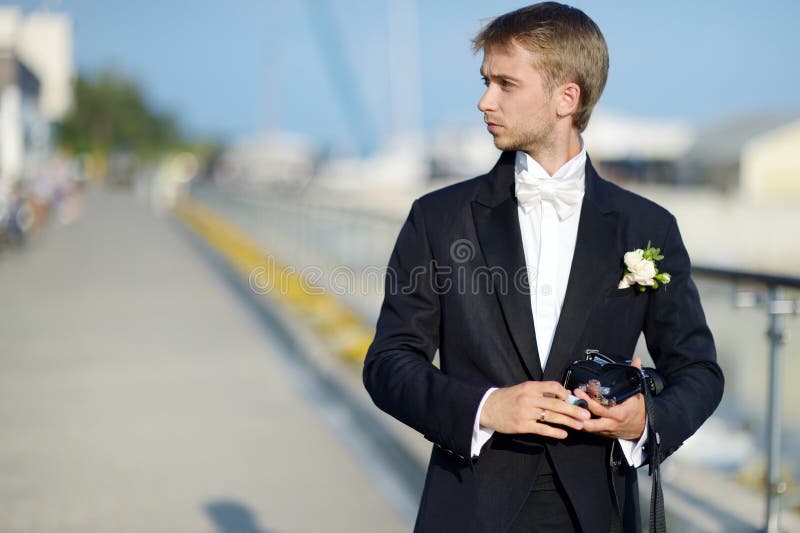 Groom Taking a Photo with a Instant Camera Stock Photo - Image of pose ...