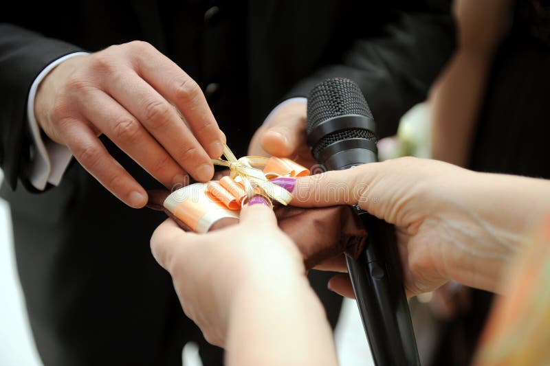 Groom Unknotting Wedding Ring Stock Photos - Free & Royalty-Free Stock ...