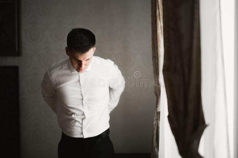 Grooms Morning Preparation. Handsome Man Getting Dressed and Preparing ...