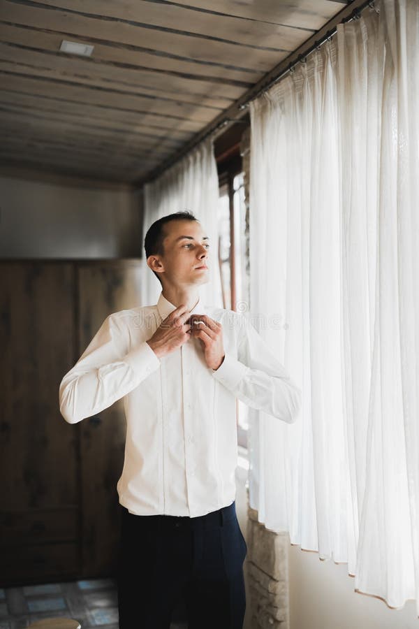 Grooms Morning Preparation. Handsome Man Getting Dressed and Preparing ...