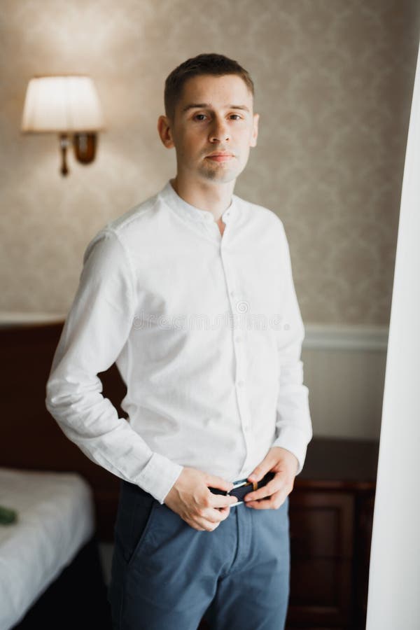 Grooms Morning Preparation. Handsome Man Getting Dressed and Preparing for the Wedding Stock ...