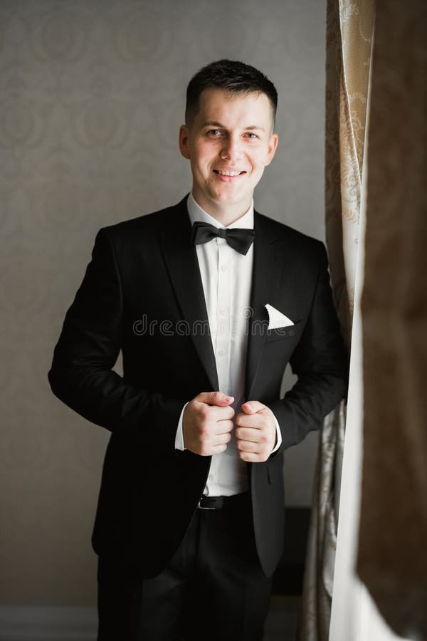 Grooms Morning Preparation. Handsome Man Getting Dressed and Preparing for the Wedding Stock ...