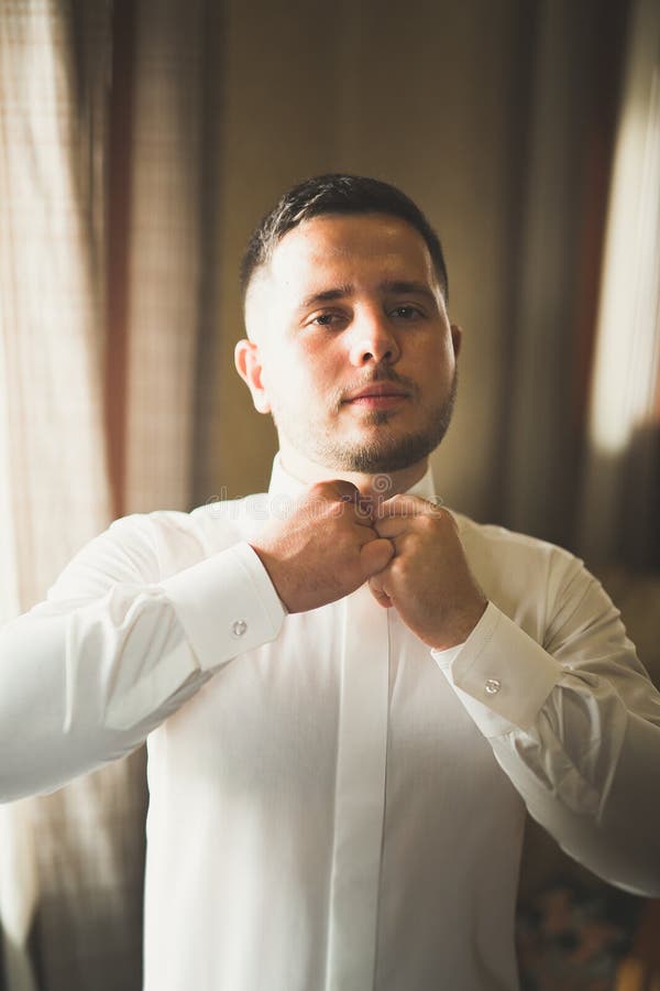 Grooms Morning Preparation. Handsome Man Getting Dressed and Preparing ...