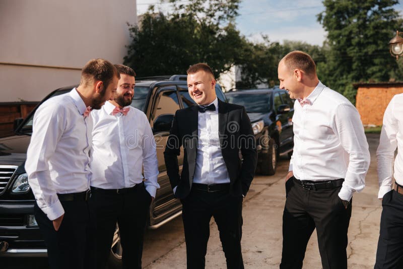 Groomsman Spend Time with Groom at the Backyard. Guys Laugh and Have ...