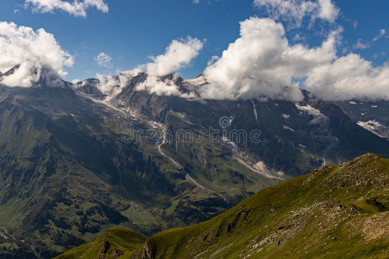 The Grossglockner Mountain Range with Snow on the Peaks and a Blue Sky ...