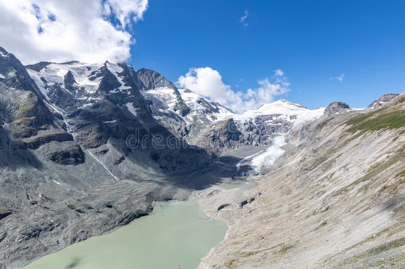 The Grossglockner Mountain Range with Snow on the Peaks and a Blue Sky ...
