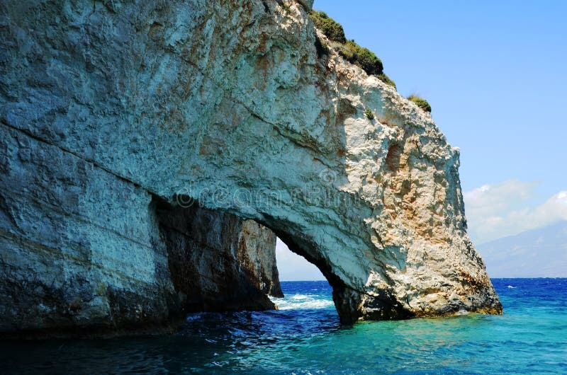 Grotto in the blue sea stock image. Image of crags, waves - 94542051