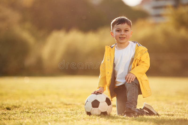 Red Colored Toy Plane. Little Boy is Playing on the Summer Field Stock ...
