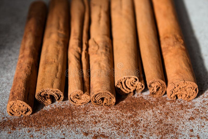 Ground Ceylon Cinnamon Sprinkled in Front of Real Cinnamon Sticks on a ...