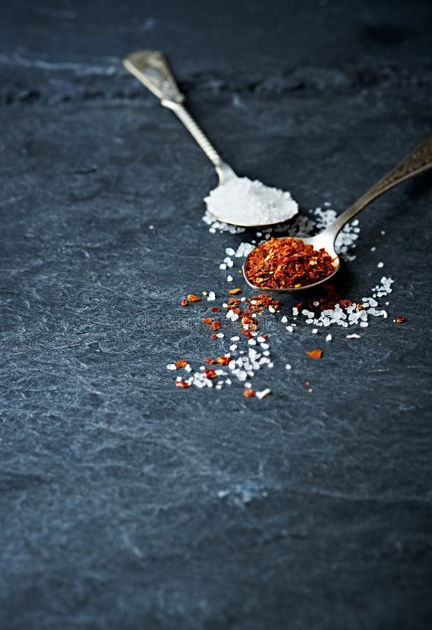 Ground Chili Pepper and Rock Salt on Spoons Stock Image - Image of ...
