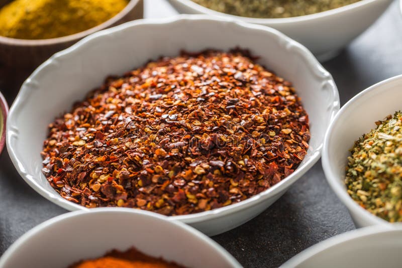 Ground Chilli Pepper and Variety Spices and Herbs in Bowls Stock Image ...