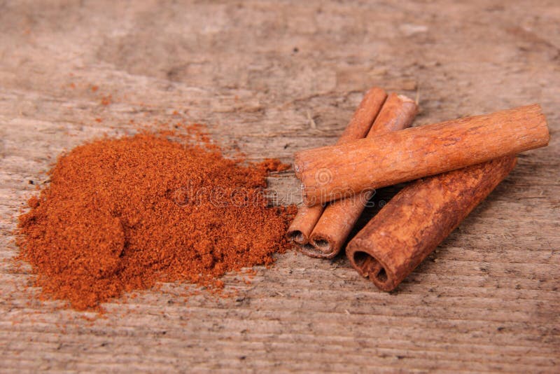 Ground Cinnamon and Cinnamon Sticks Stock Photo - Image of spices ...