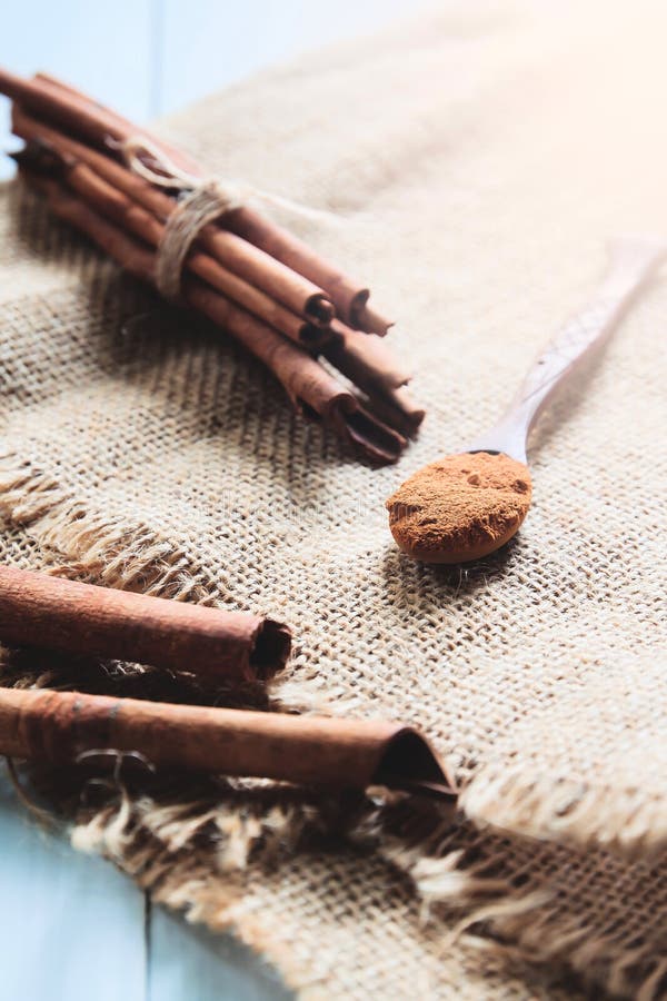 Ground Cinnamon and Cinnamon Sticks on Wooden Table, Rustic and Stock ...