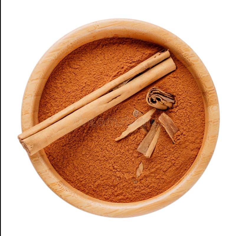 Ground Cinnamon and Cinnamon Sticks in Wooden Bowl Isolated on White ...
