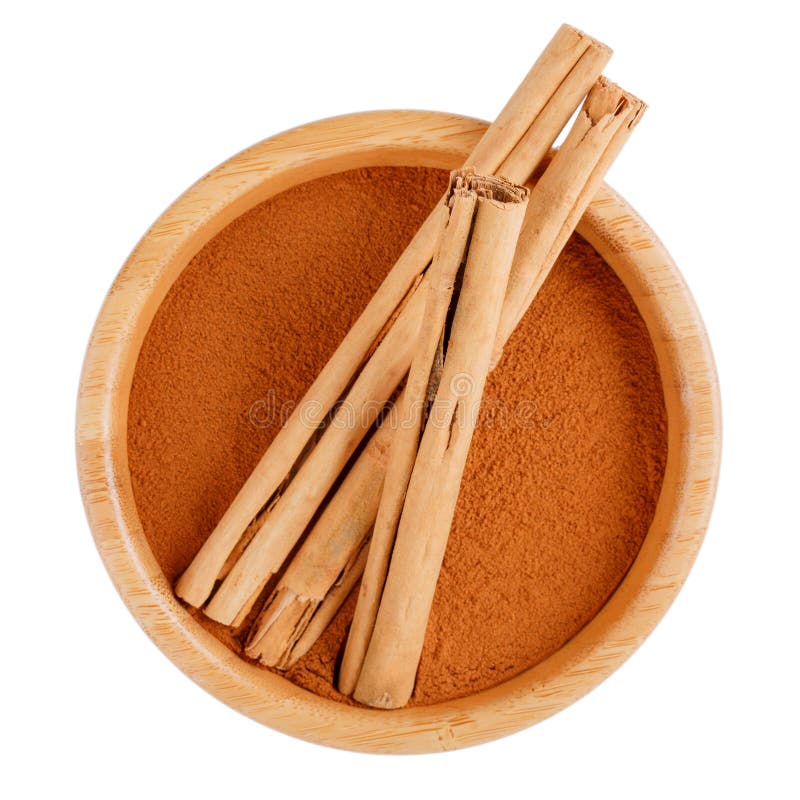 Ground Cinnamon and Cinnamon Sticks in Wooden Bowl Isolated on White ...