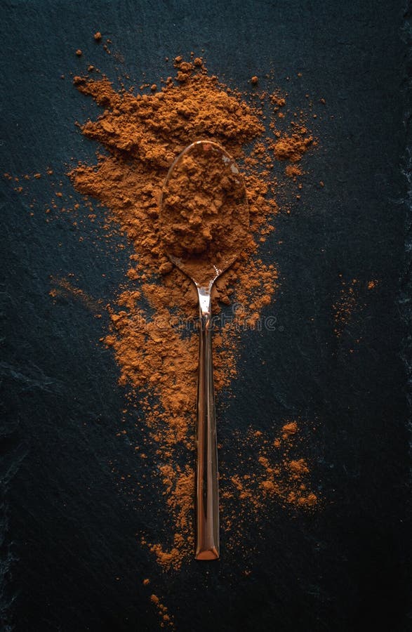 Ground Cinnamon in Teaspoon on Dark Background, Top View, Text Space ...