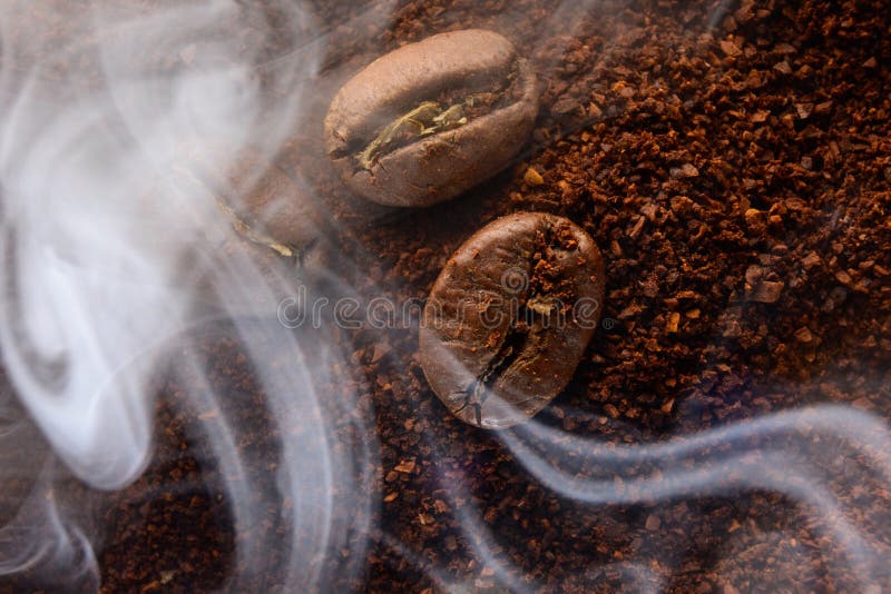 Ground Coffee and Coffee Beans, Coffee in Light Smoke. Stock Photo ...
