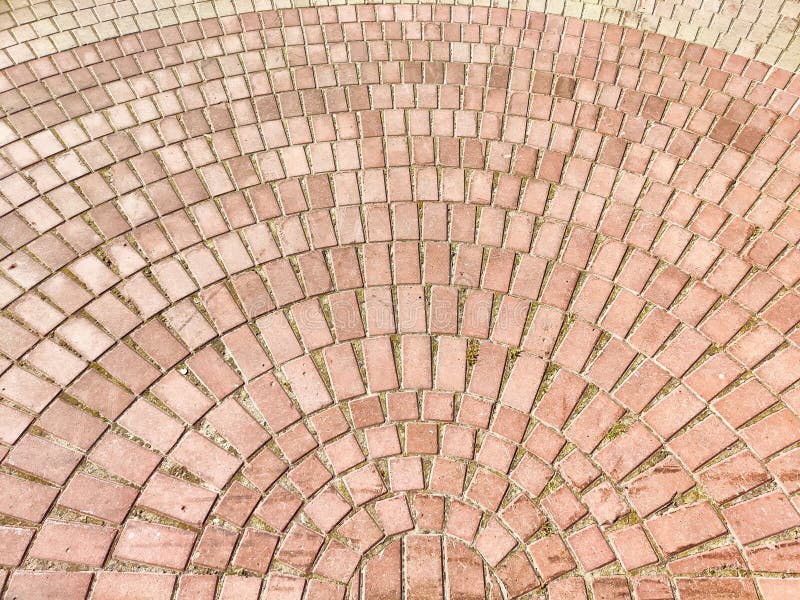 The Ground is Covered with a Detailed Arrangement of Red Bricks ...