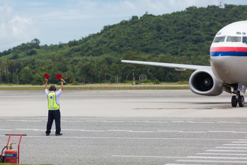 Ground Crew Signaling To Airplane Stock Photo - Image of industry ...