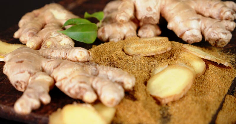 On Ground Ginger Powder Falling Pieces of Fresh Ginger. Stock Footage ...