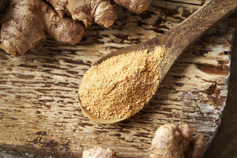 Ground Ginger Powder with Fresh Ginger Root, Top View Stock Photo ...