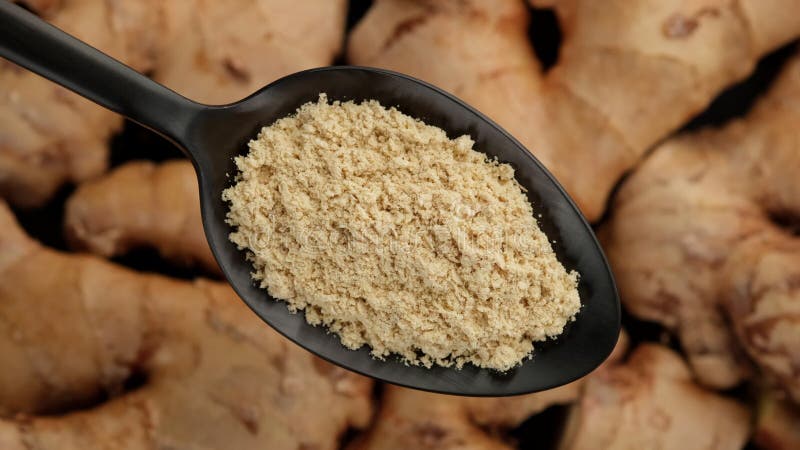 Ground Ginger in Spoon and Whole Ginger Root on Background Rotating ...