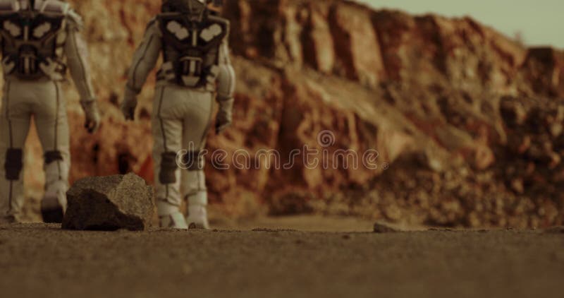 Unrecognizable Astronauts Walking on Arid Ground of Mars Stock Video ...