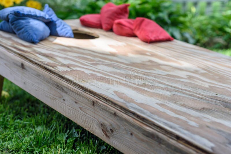 Ground Level Side View of Cornhole Game Board with Bags on Top I Stock ...