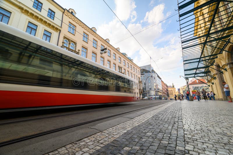 Ground Level View of Tram with Motion Blur through Old Town District of ...