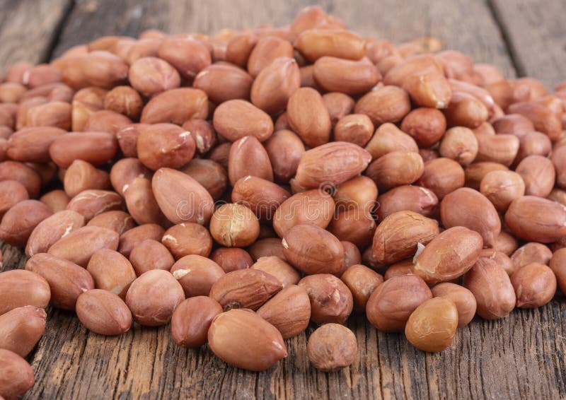 Ground Peanuts on Wooden Background Stock Photo - Image of macro ...